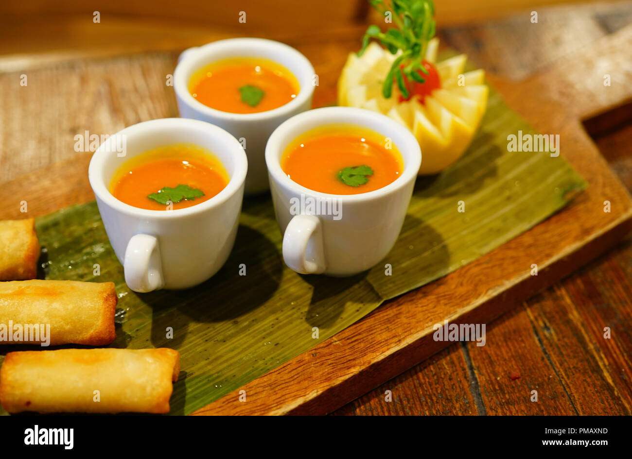 Vegan tomato soup in mini coffee cups and other vegan appetizers served ...