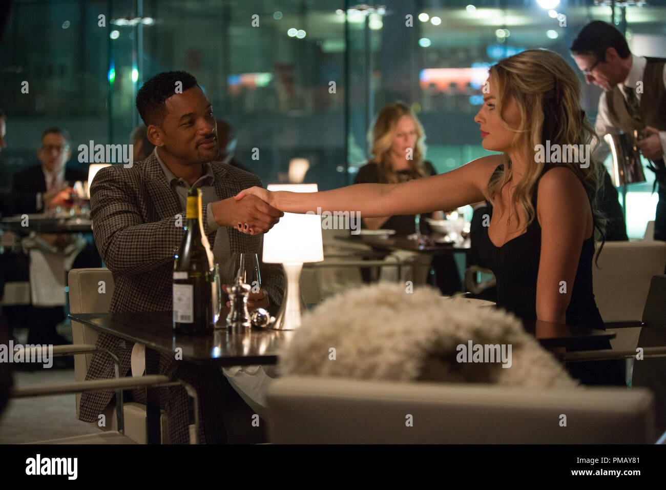 L R Will Smith Stars As Nicky And Margot Robbie As Jess In Warner Bros Pictures Heist Film
