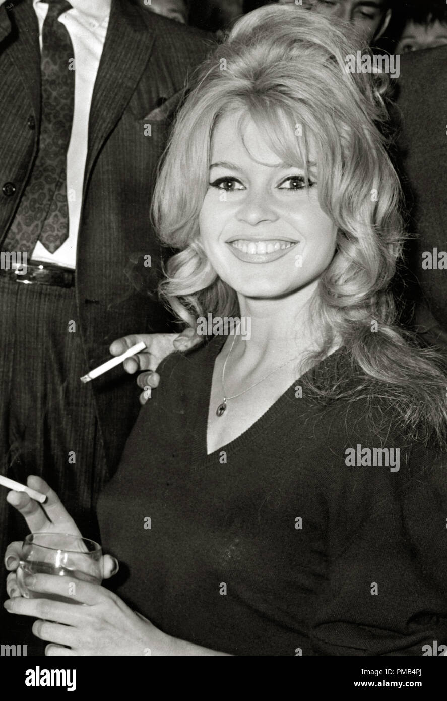 Brigitte Bardot smoking a cigarette, circa 1963 File Reference # 33371 ...