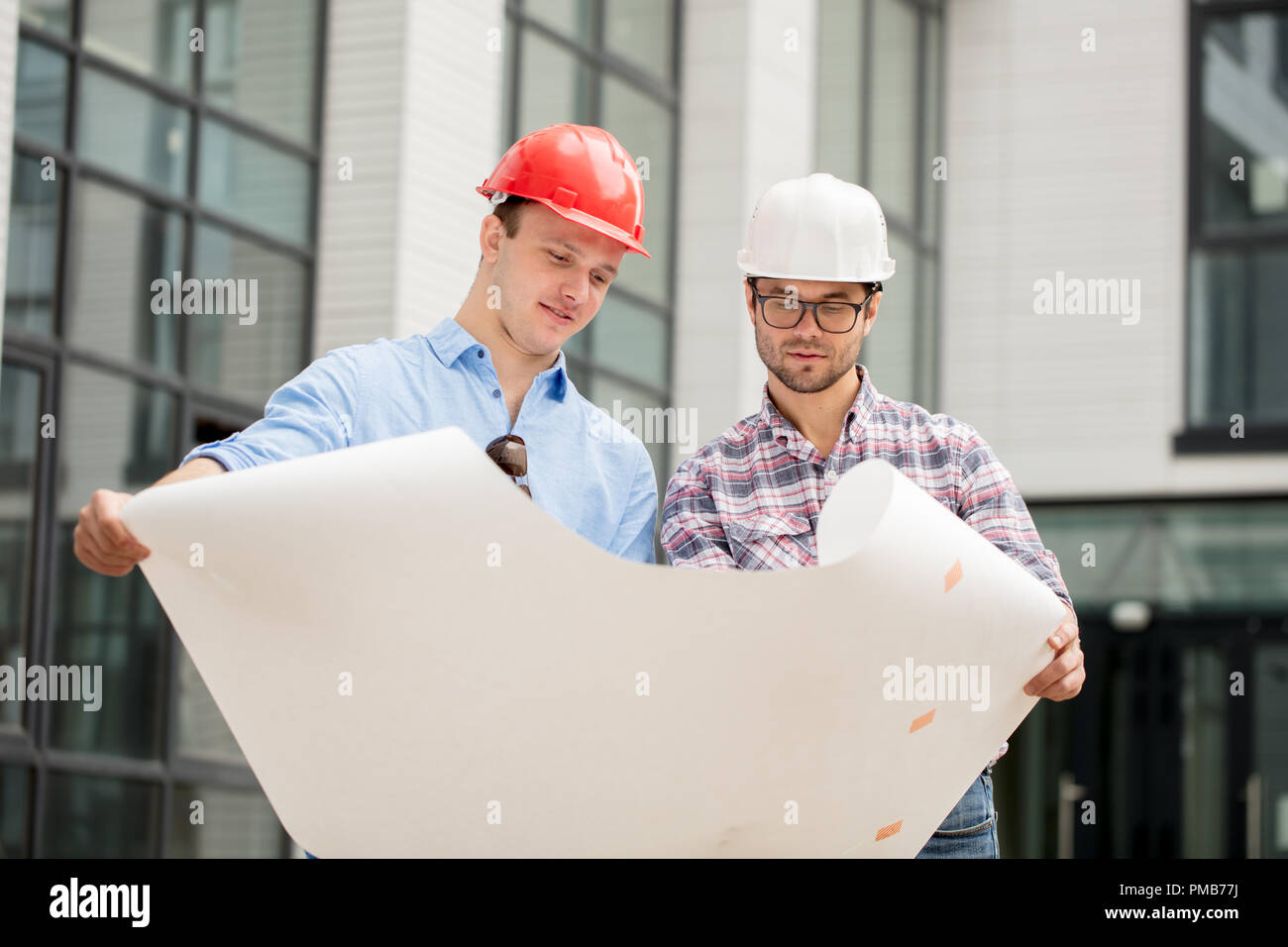 team of constructors are working according the plan and scheme Stock ...