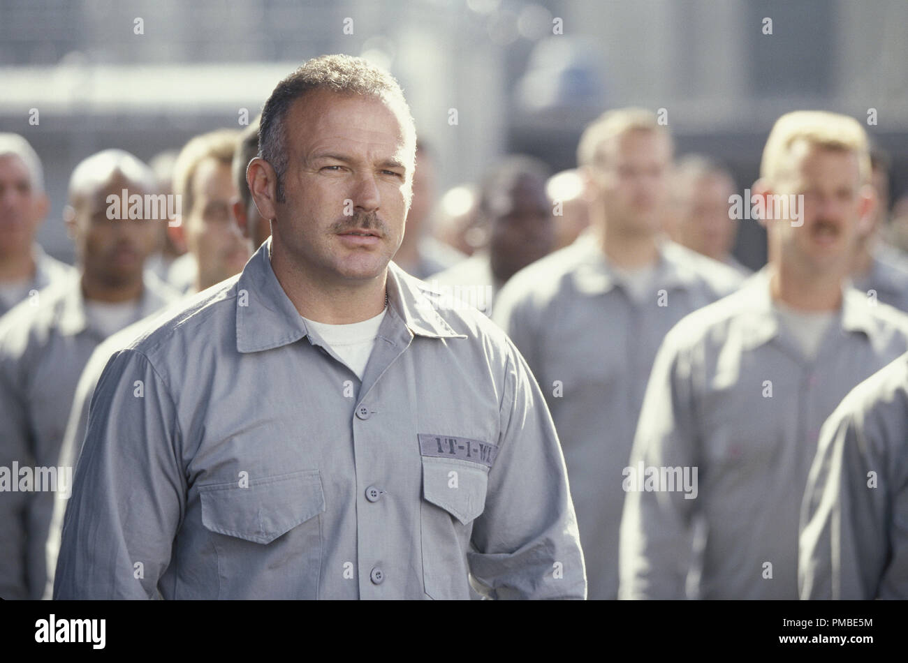 Prisoner Beaupre (BRIAN GOODMAN) assembles with his fellow inmates ...