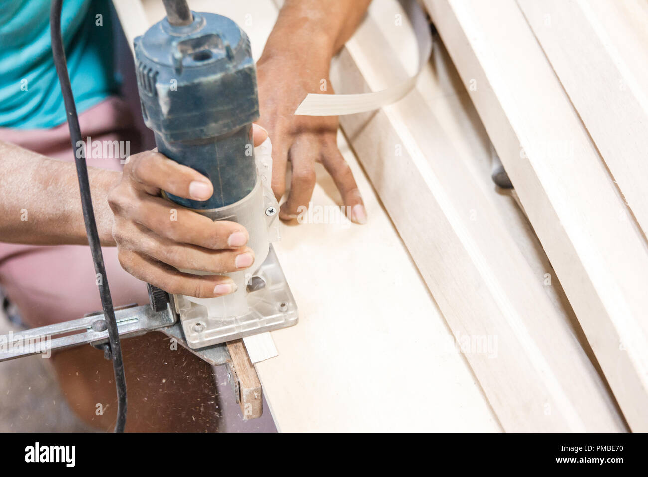 workers hands cutting the edge of wood board using fret saw Stock Photo ...