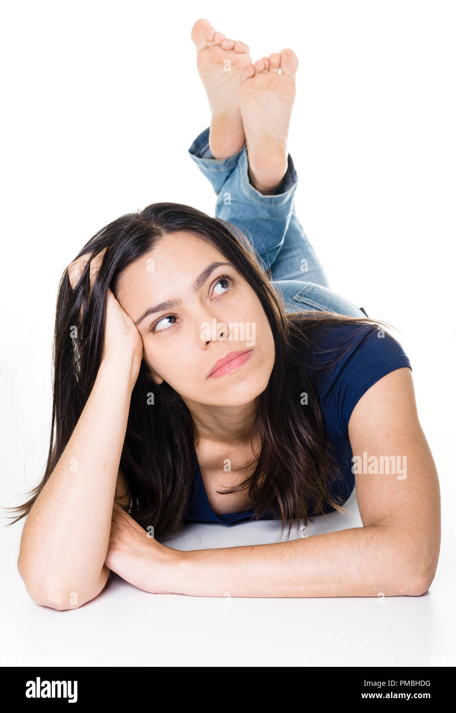 Close portrait of a lovely brunette lying down Stock Photo - Alamy