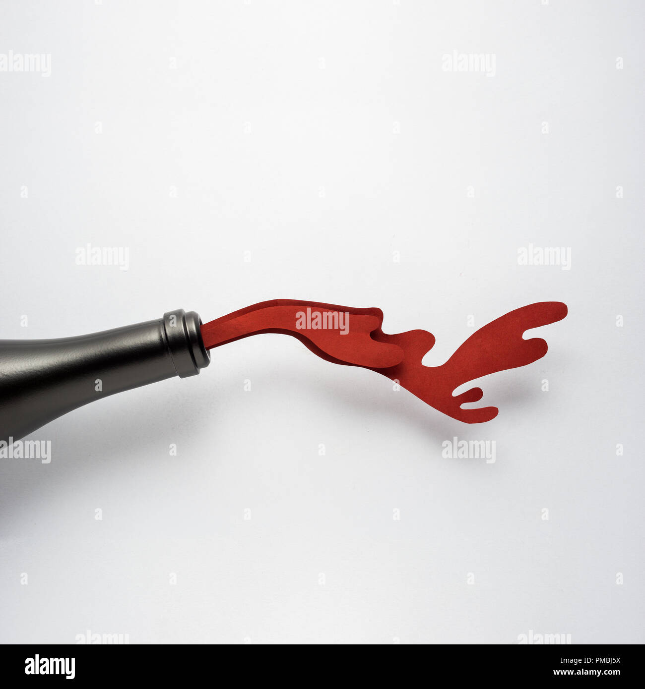 Creative concept photo of bottle with wine made of paper on grey ...