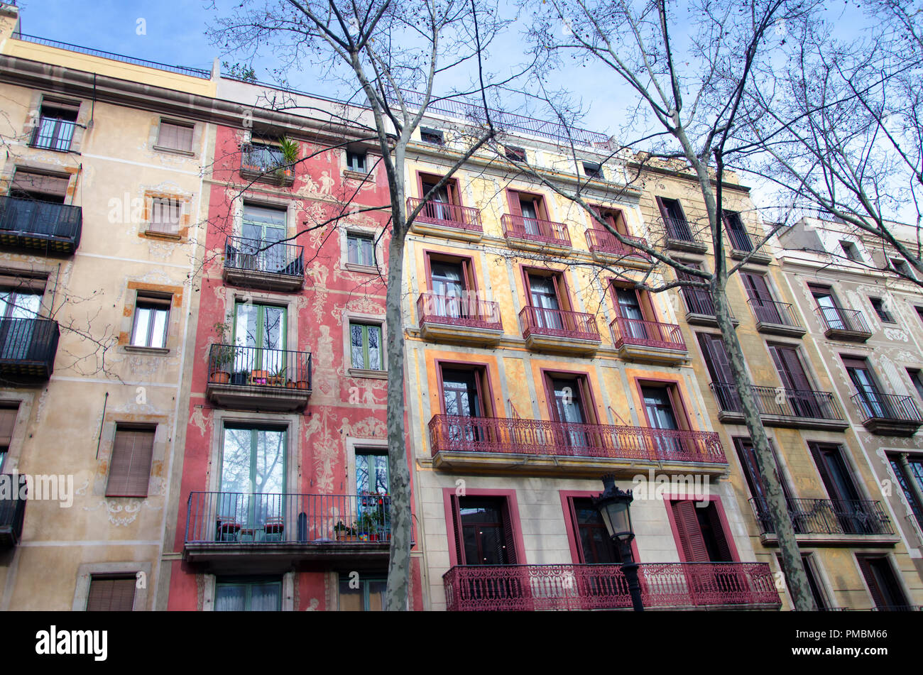 Colorful buildings with paintings in the center of Barcelona, Spain ...