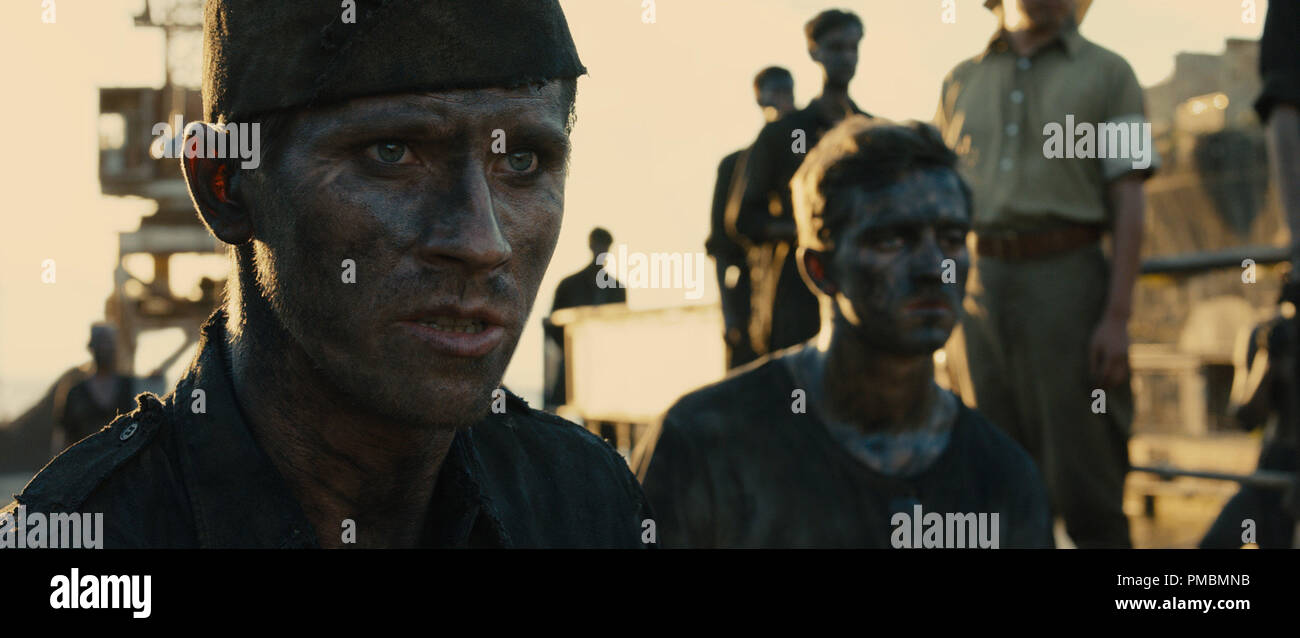 (Foreground) Commander John Fitzgerald (GARRETT HEDLUND) wonders what ...