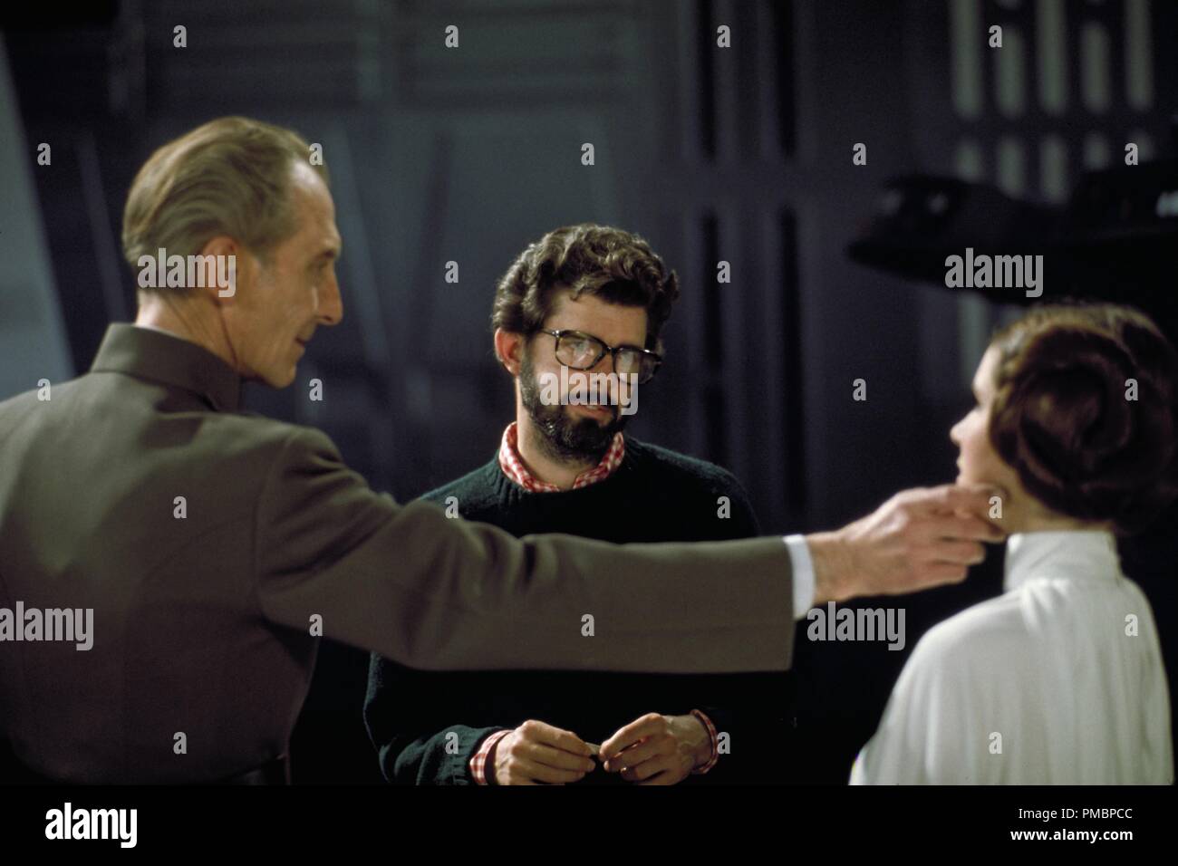 Peter Cushing, George Lucas, and Carrie Fisher on the Death Star set in ...
