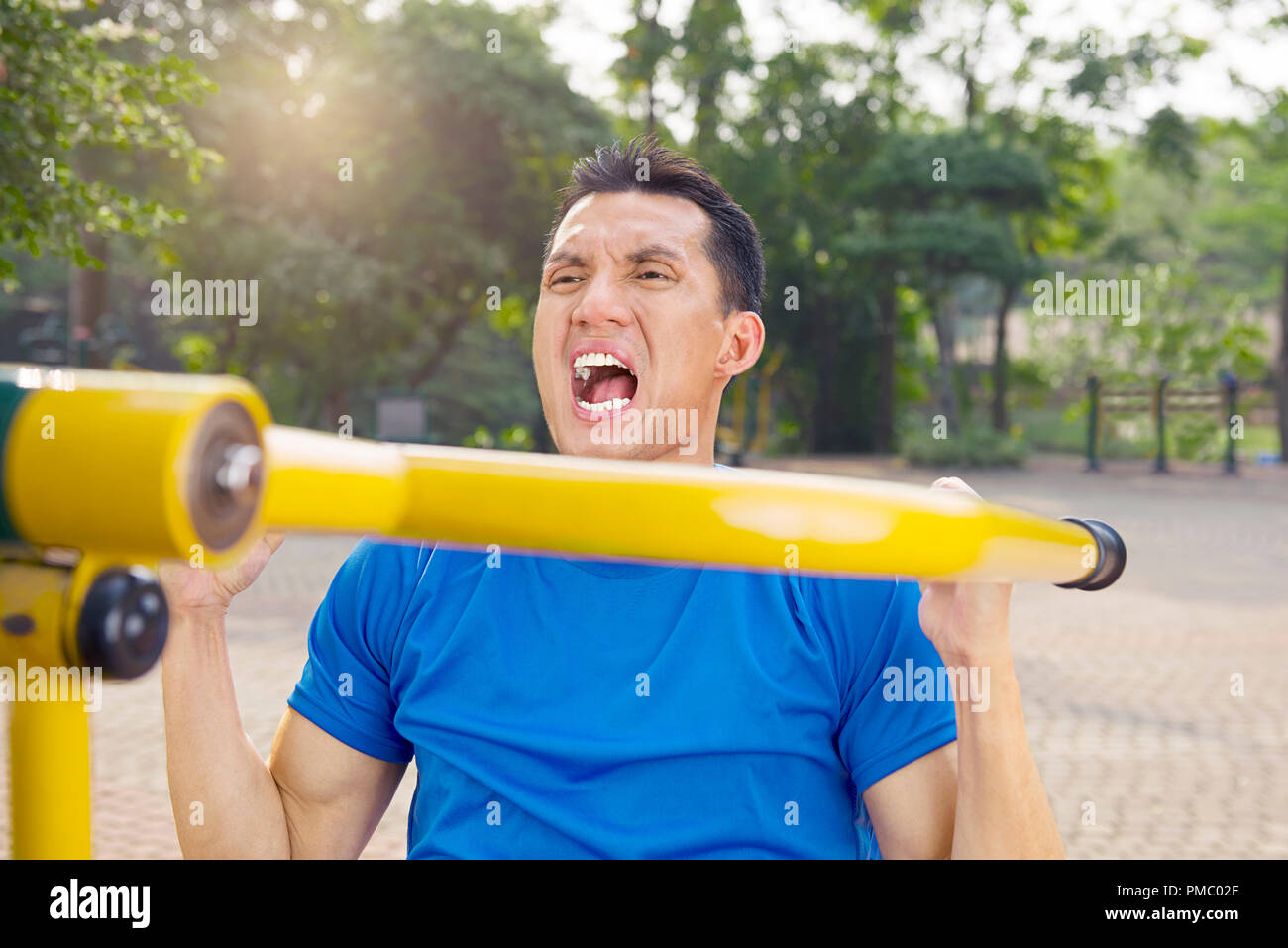 Attractive asian man doing working out at outdoor gym Stock Photo - Alamy