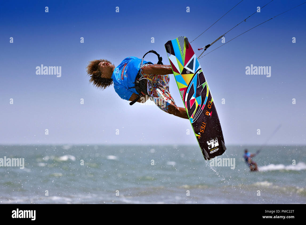 Kiteboarding action. Kiteboard rider airborne Stock Photo - Alamy