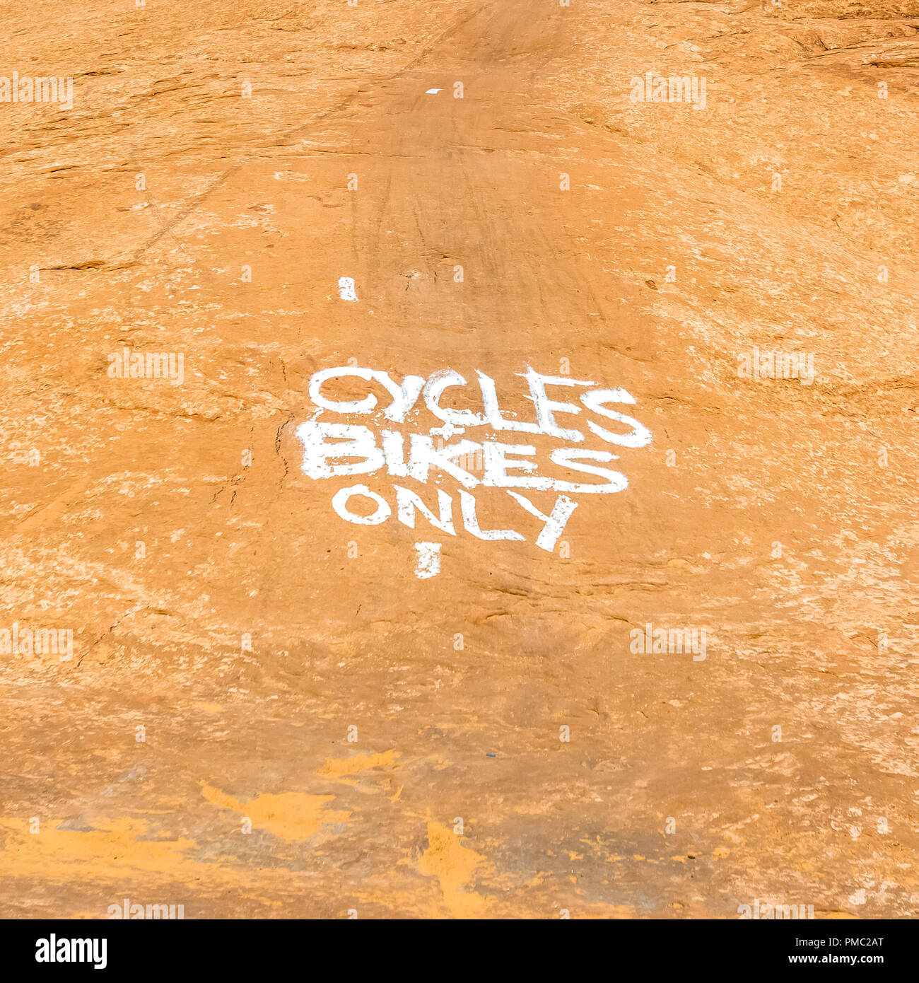 Cycles bike only sign painted on the ground Stock Photo - Alamy