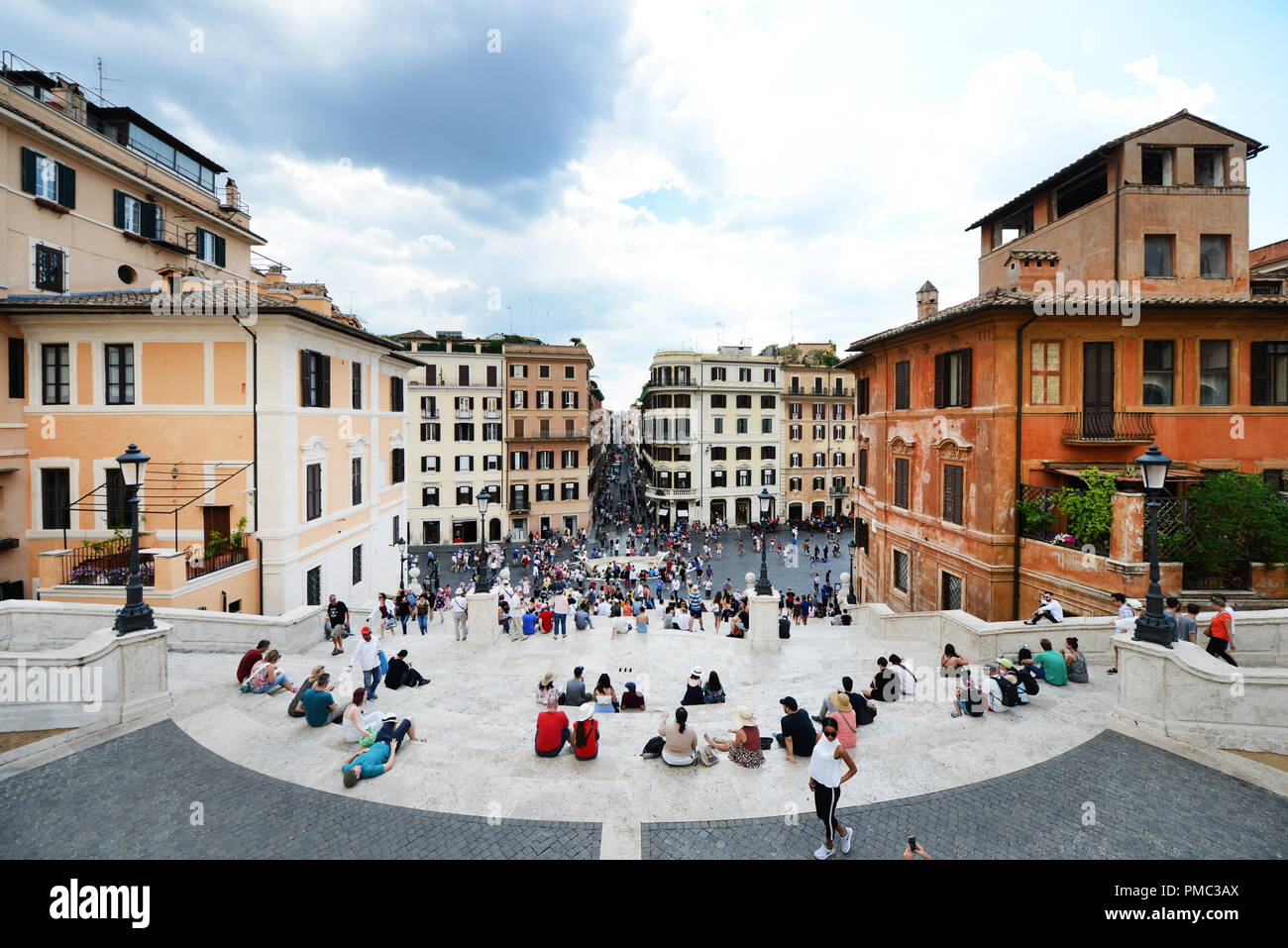 Tourist sitting on the Spanish steps and enjoying the view of piazza di ...