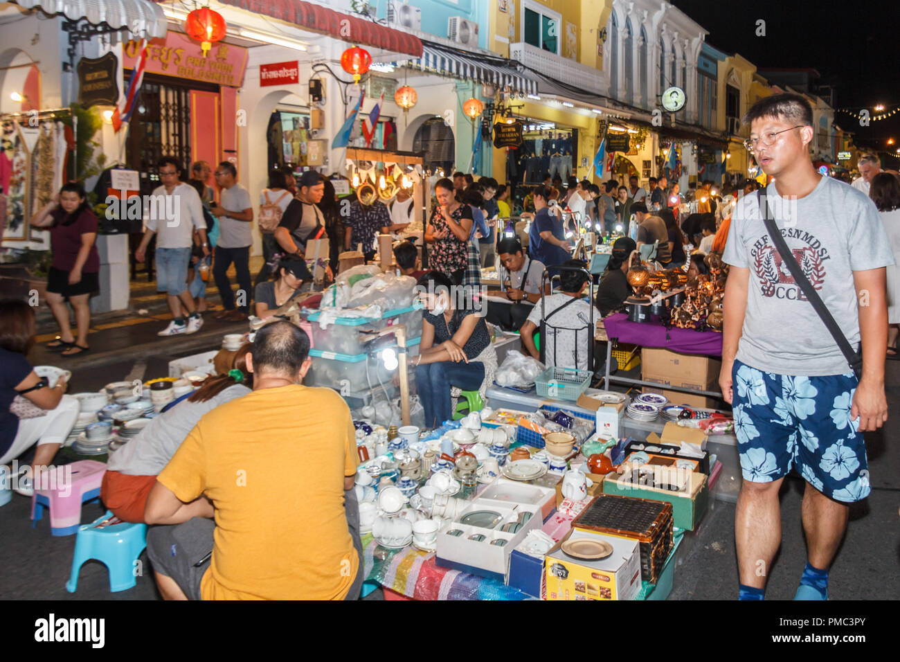 Phuket Town, Thailand - 5th August 2018: A Chinese tourist walks by a ...