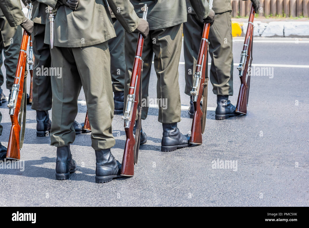 Soldiers stand in row with gun in hand. Army, Military Boots lines of ...