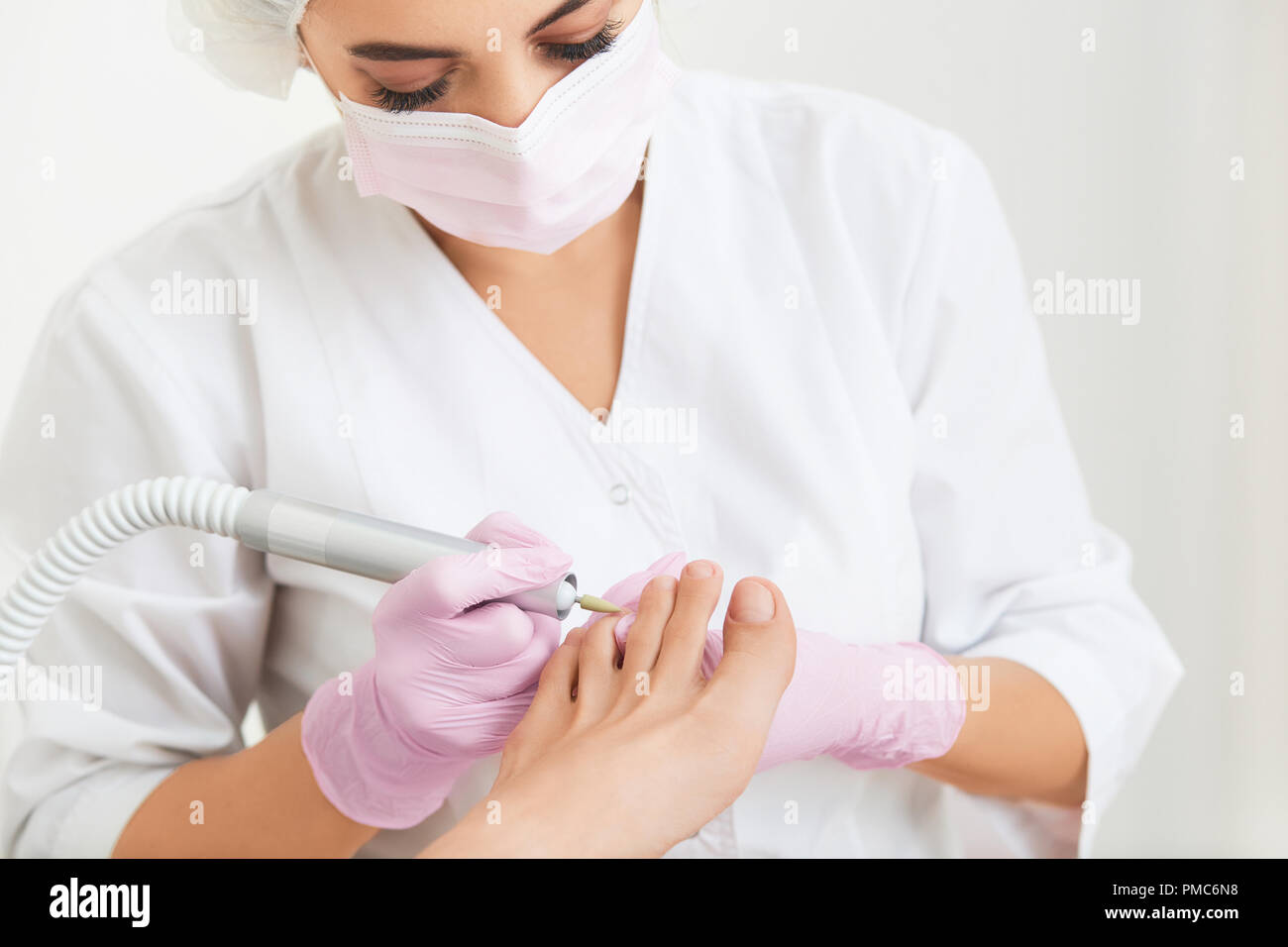 Professional hardware pedicure using electric machine.Patient on ...