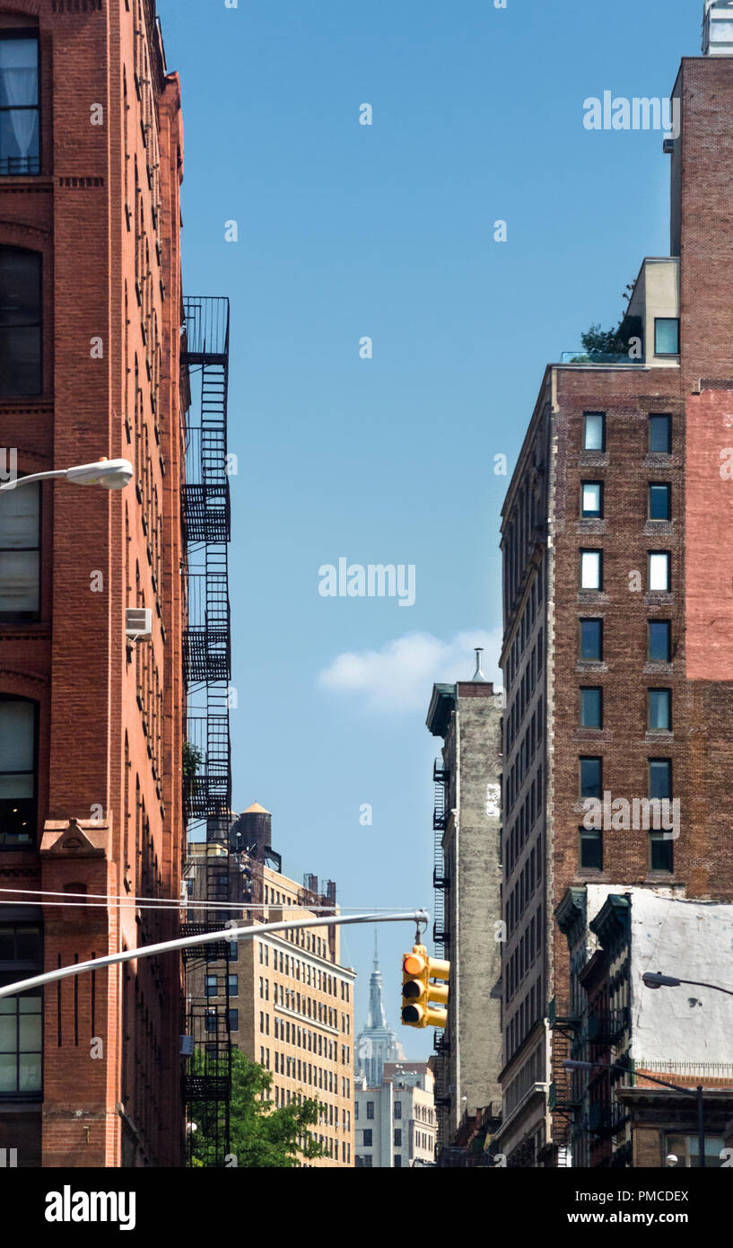 Brick Buildings in Lower Manhattan, with the Top of the Empire Building ...