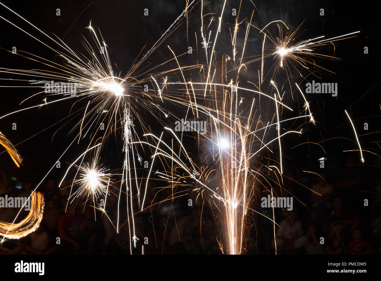 Sparkling firework with burning flame in motion Stock Photo - Alamy