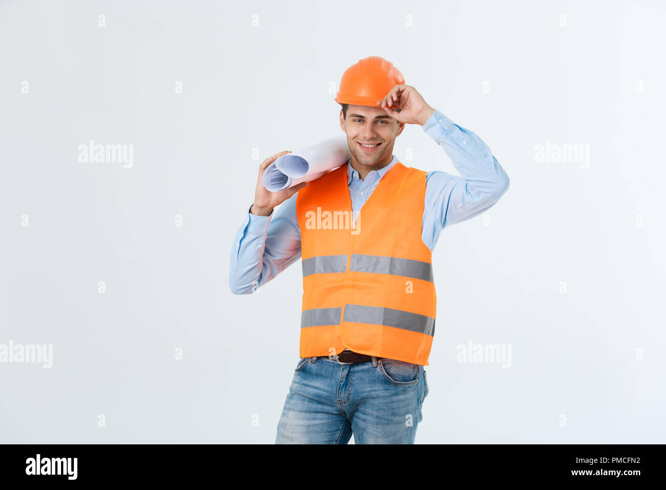 Professional young engineer with blueprint, isolated on white Stock ...