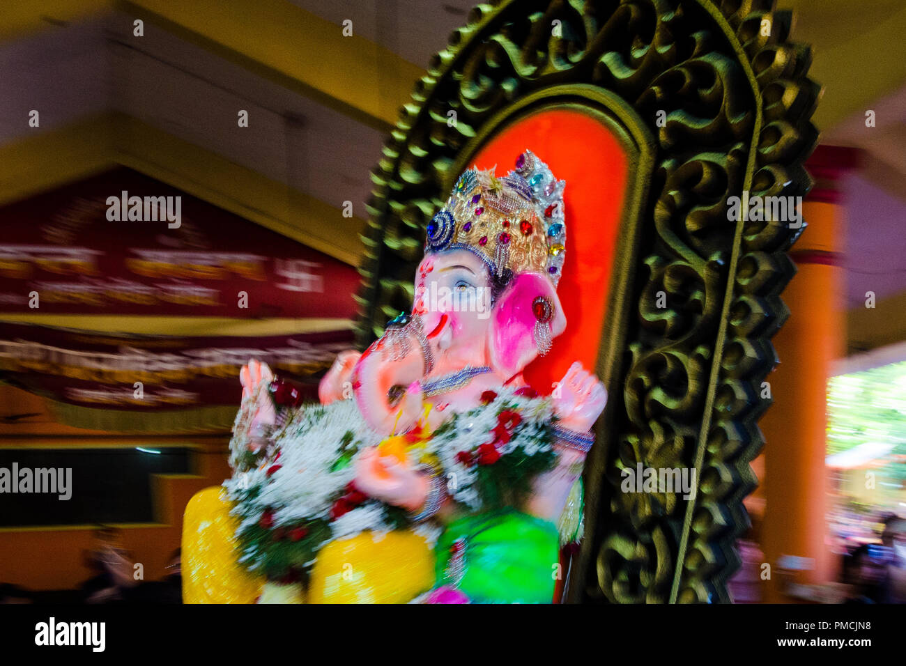 A beautiful Ganesha idol is taken in circles before the final prayer ...