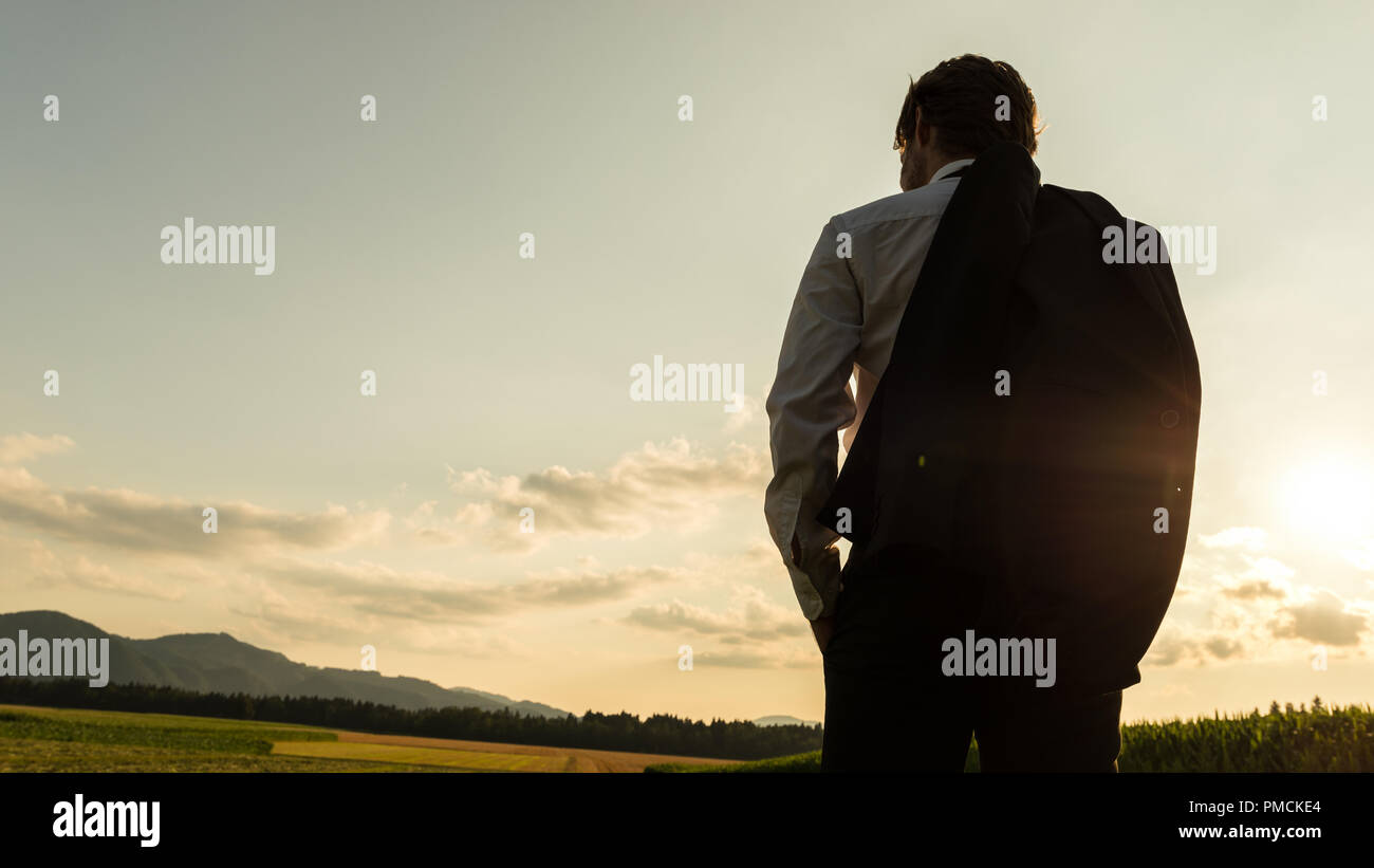 Jacket over shoulder from behind hi-res stock photography and images ...
