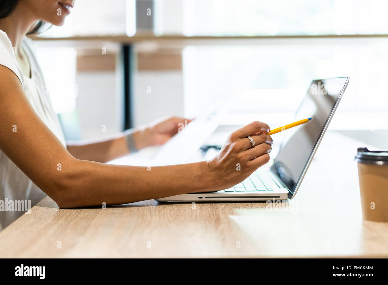 Hands of Businesswoman working on Laptop Computer with Data Charts ...