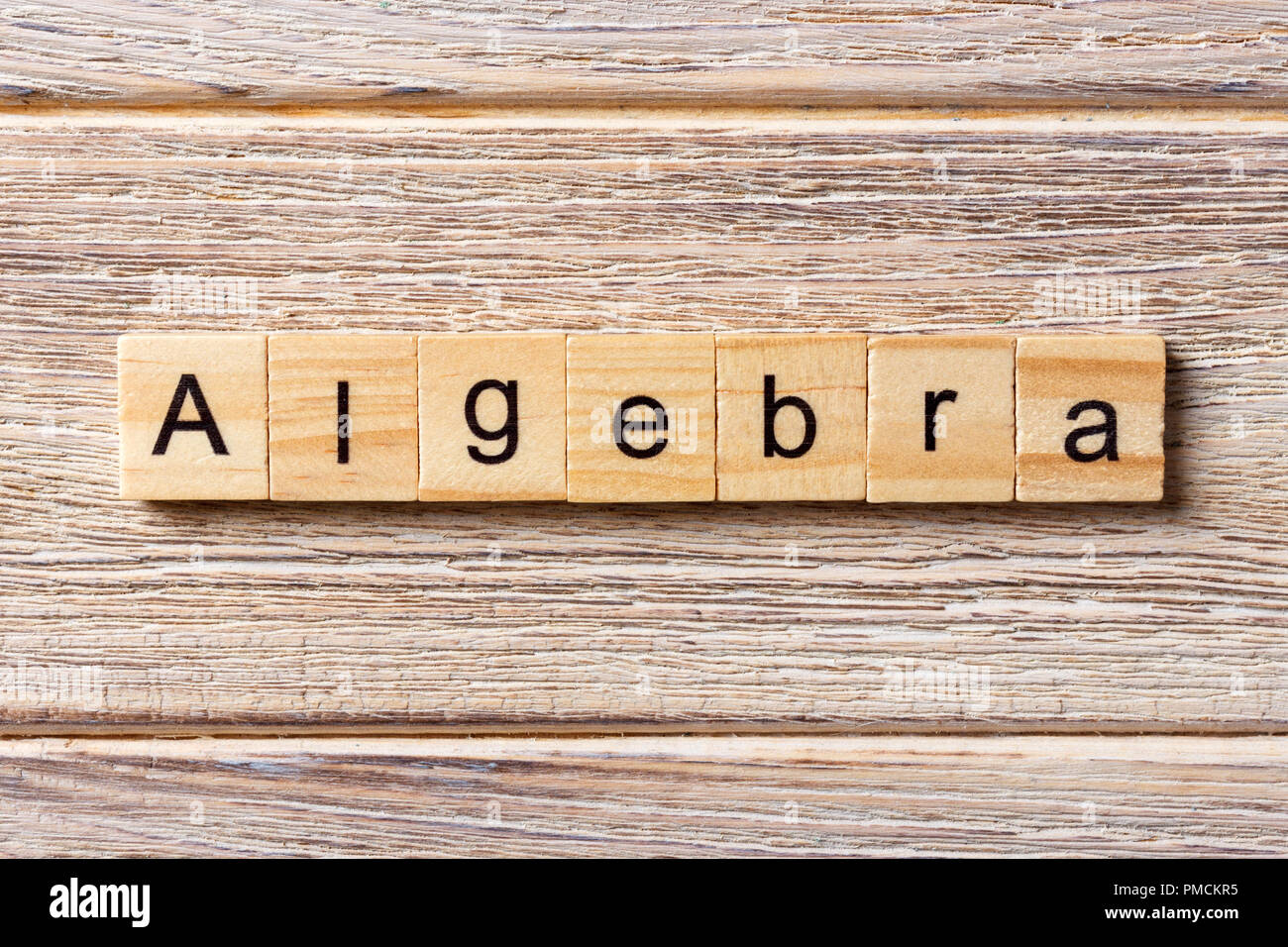Algebra word written on wood block. Algebra text on table, concept ...