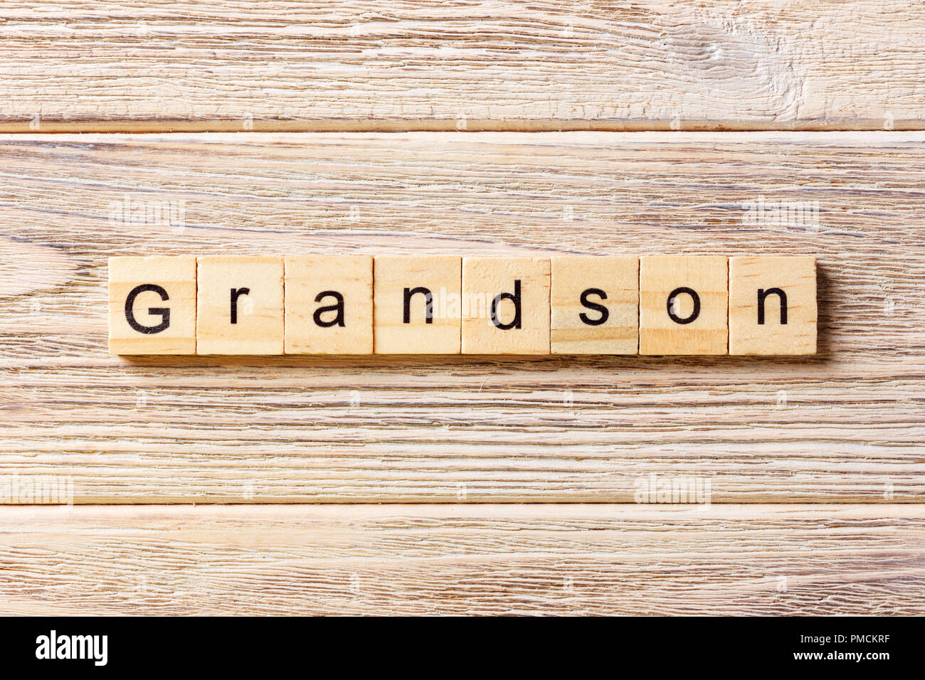 grandson word written on wood block. grandson text on table, concept ...