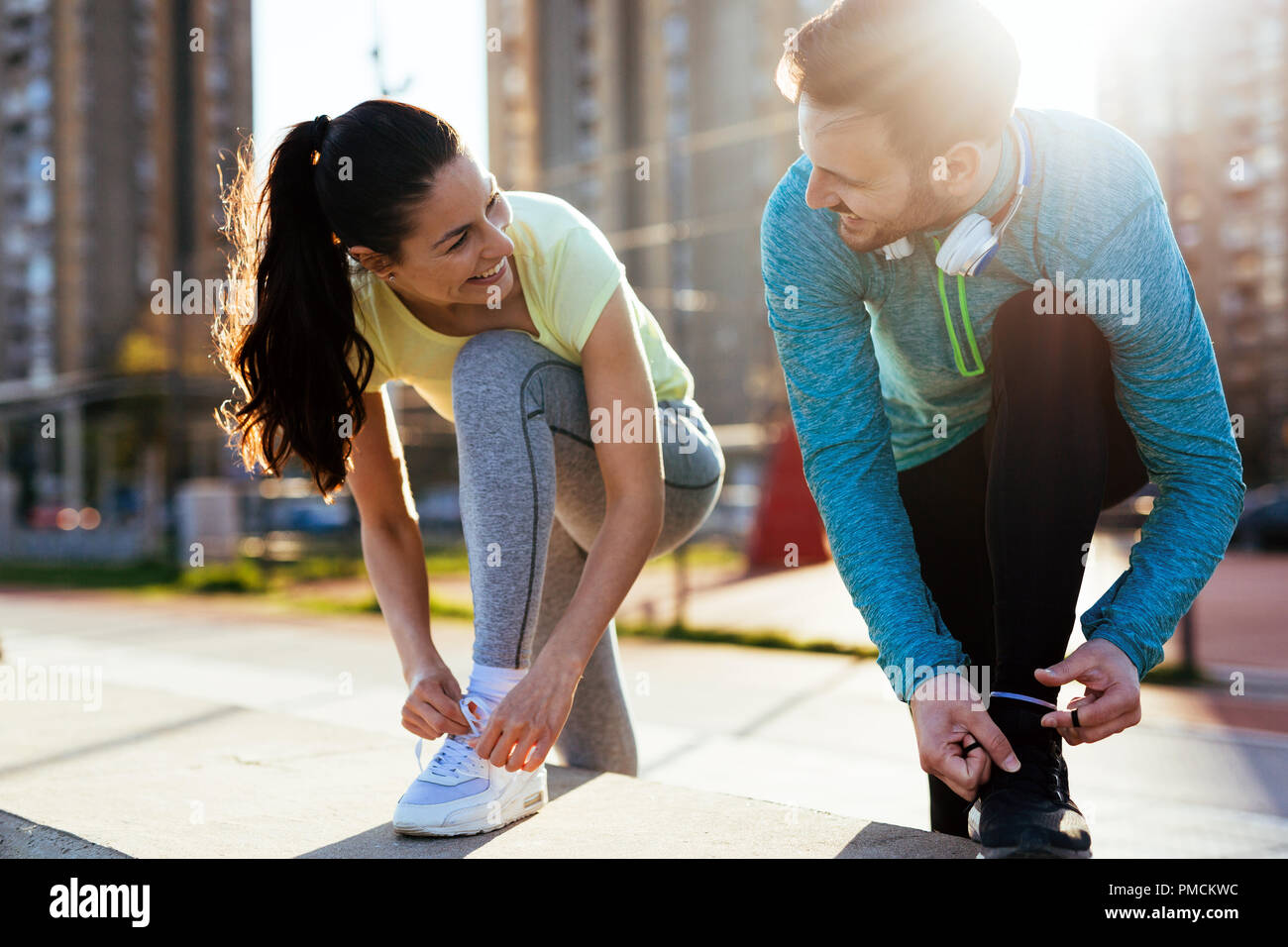 Runner man tying running hi-res stock photography and images - Alamy