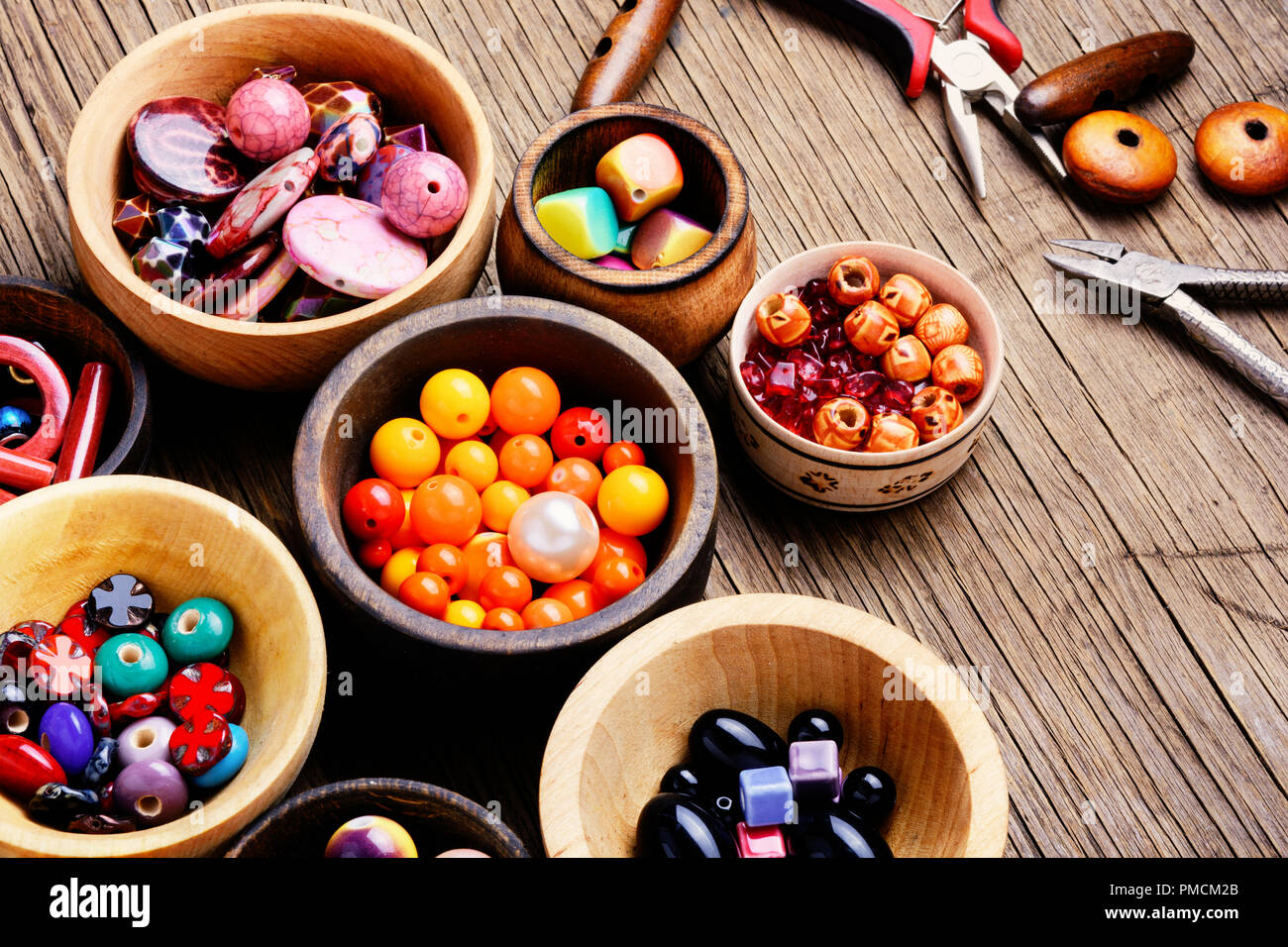 Variety of shapes and colors beads to make a bead necklace.Handcraft ...