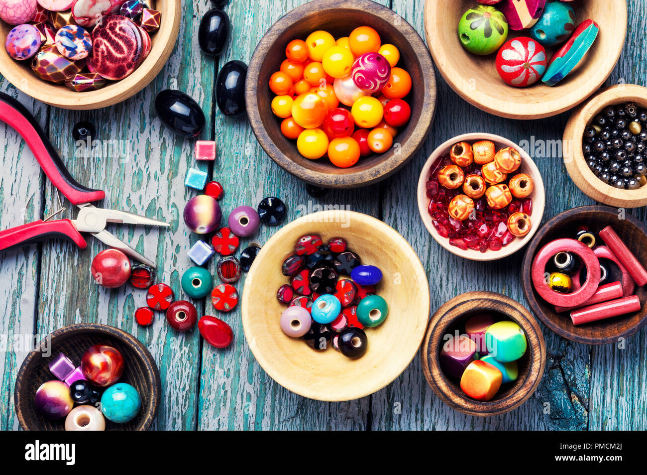 Variety of shapes and colors beads to make a bead necklace.Handcraft ...