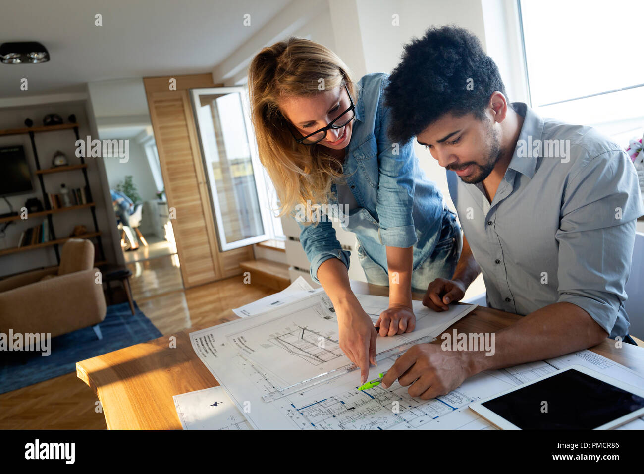 Business People and architects working on project together Stock Photo ...