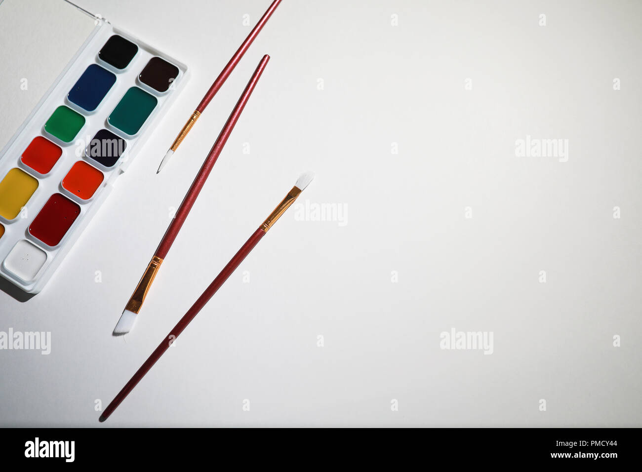 Drawing paints on a white sheet of paper Stock Photo - Alamy
