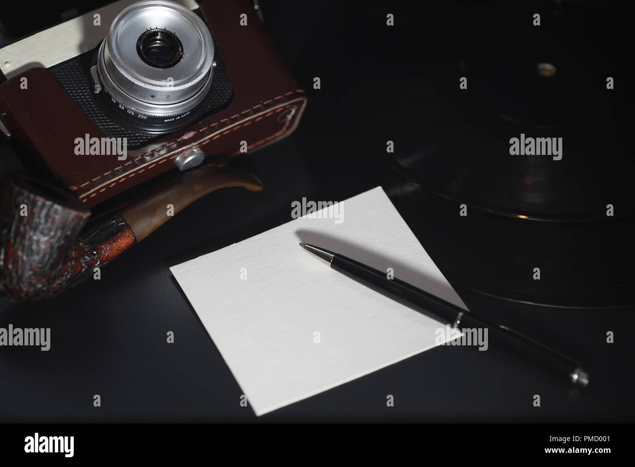 Vinyl plate and retro camera Stock Photo - Alamy