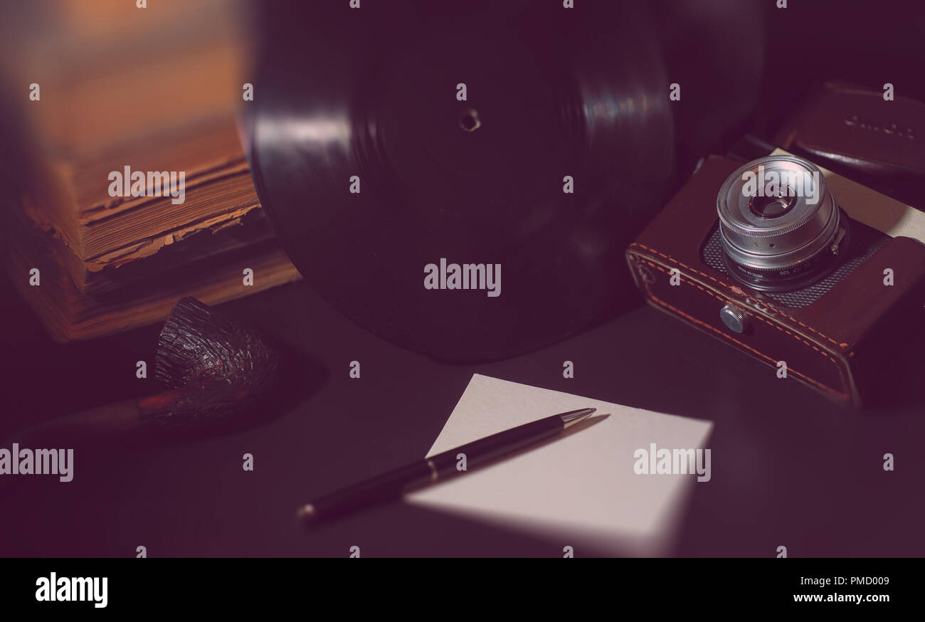 Vinyl plate and retro camera Stock Photo - Alamy