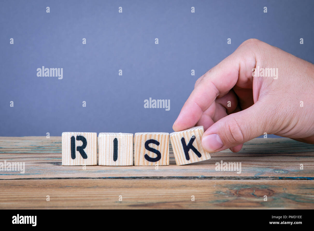 risk. Wooden letters on the office desk Stock Photo - Alamy