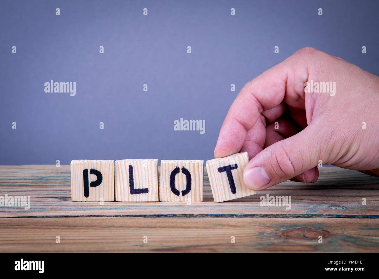 plot. Wooden letters on the office desk Stock Photo - Alamy