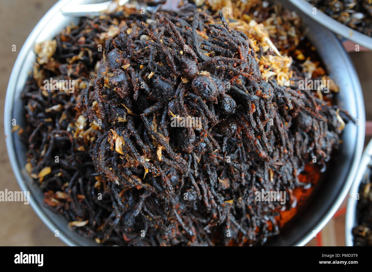 Fried Tarantulas at an open air market, fried spider is a regional delicacy in Cambodia. Skuon ...