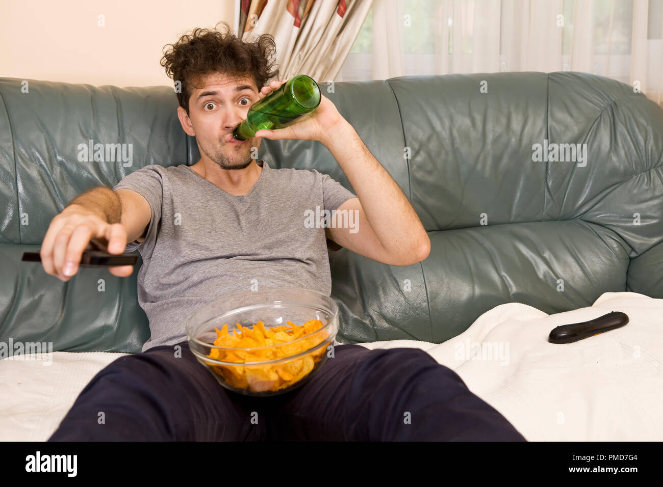 Man relax after work watching tv and drinking beer Stock Photo - Alamy