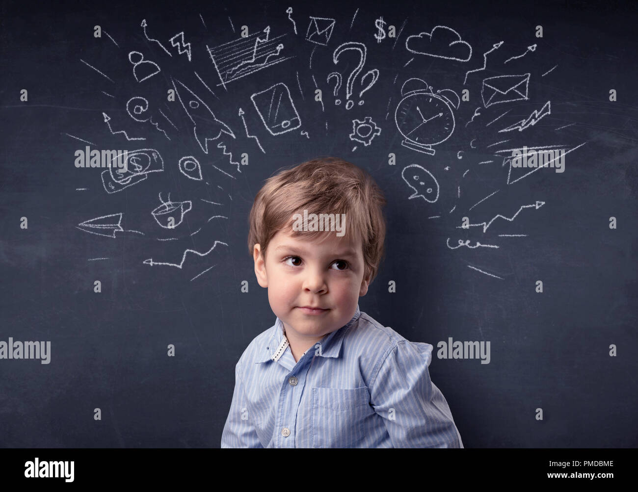 Smart little kid in front of a drawn up blackboard ruminate Stock Photo ...