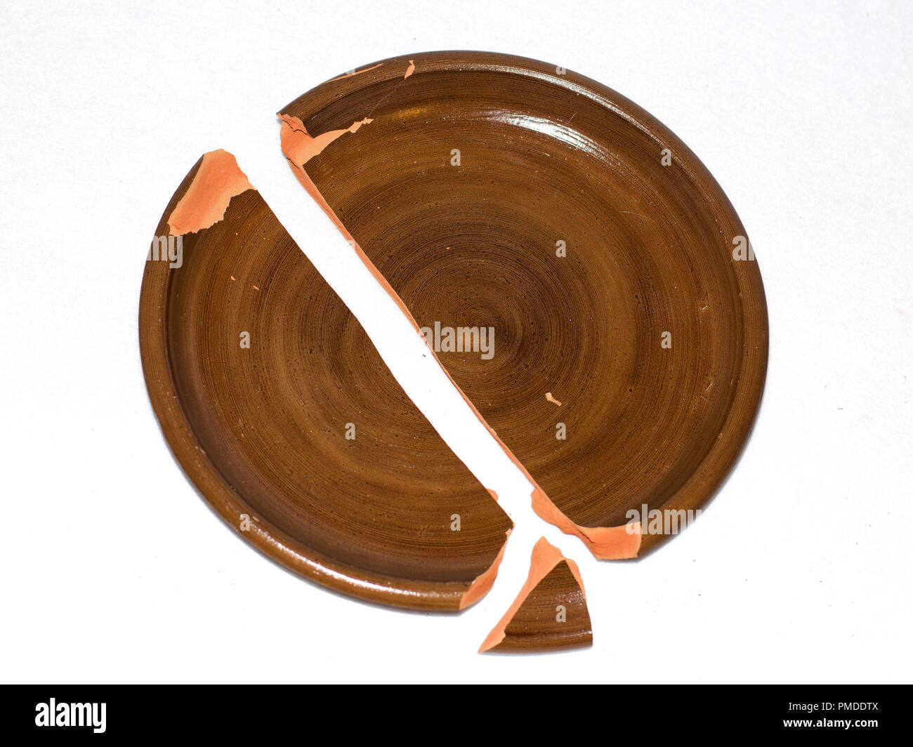 Broken clay dish. Isolated on the white background Stock Photo - Alamy