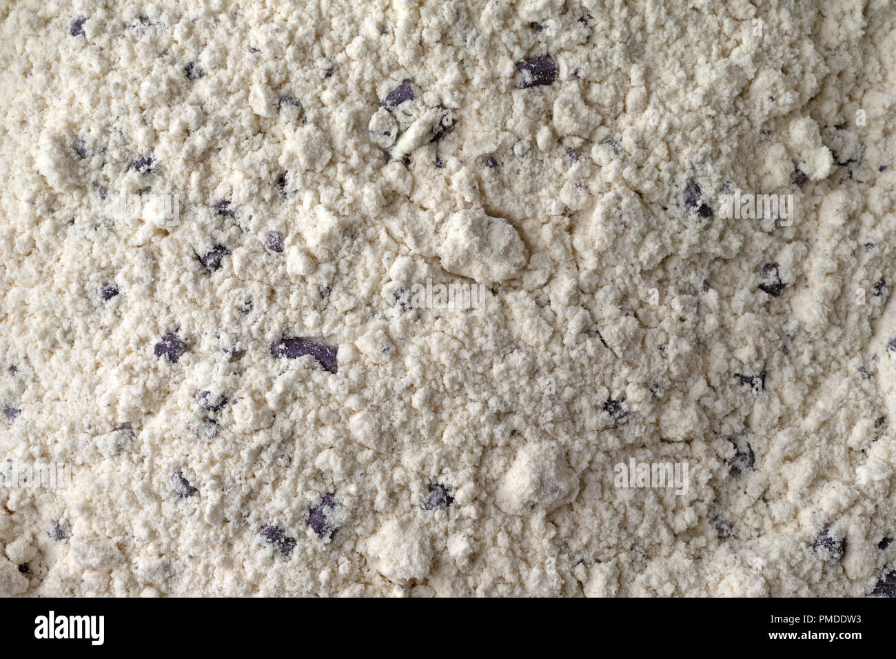 Very close view of clumpy blueberry muffin mix with imitation ...