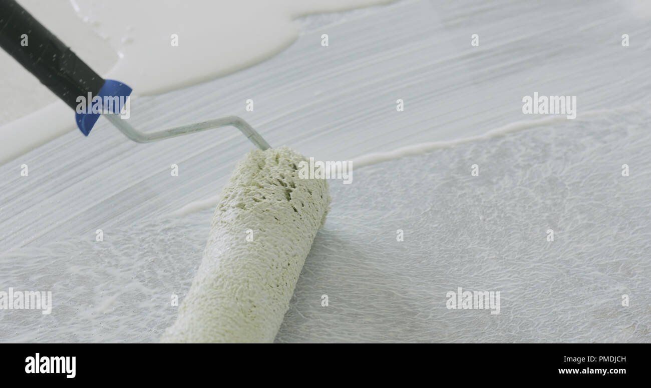 Applying liquid primer coating construction hi-res stock photography ...