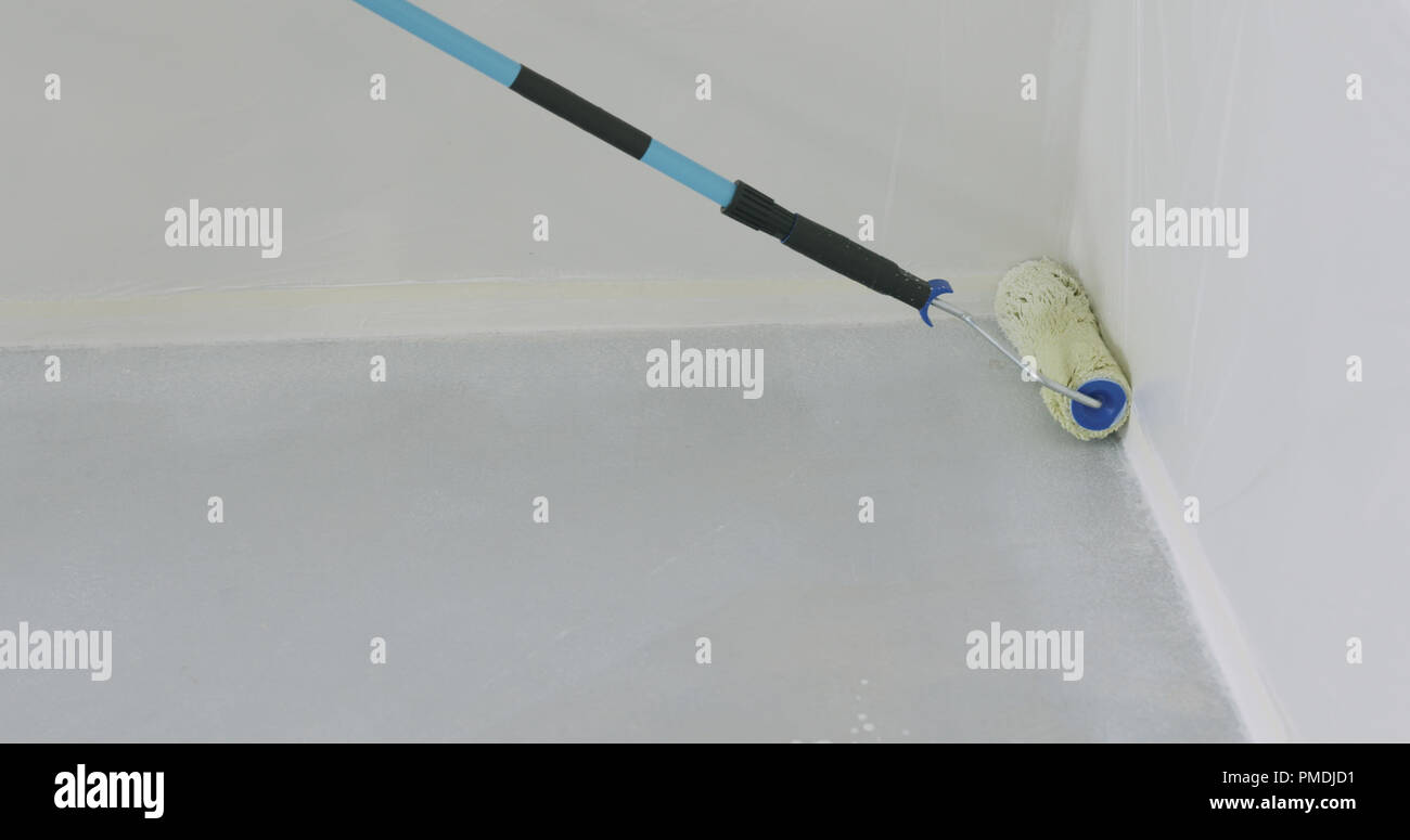 Applying liquid primer coating construction hi-res stock photography ...