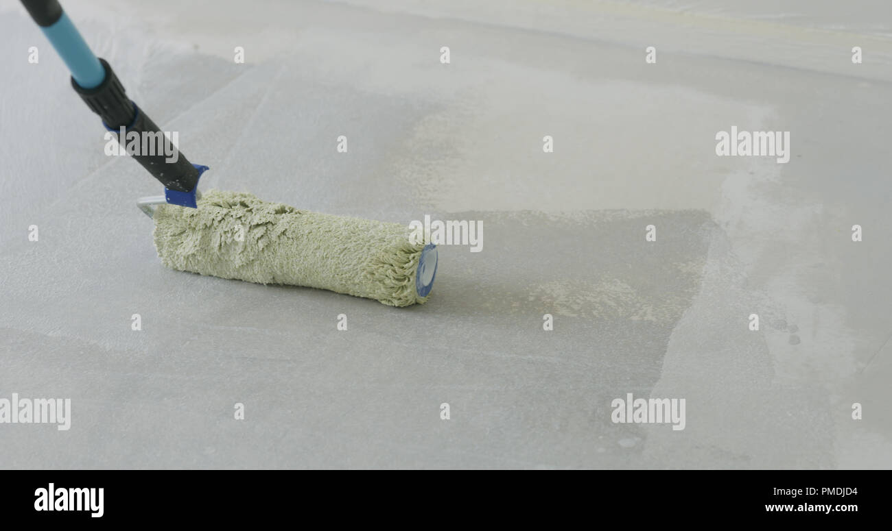 Applying liquid primer coating construction hi-res stock photography ...