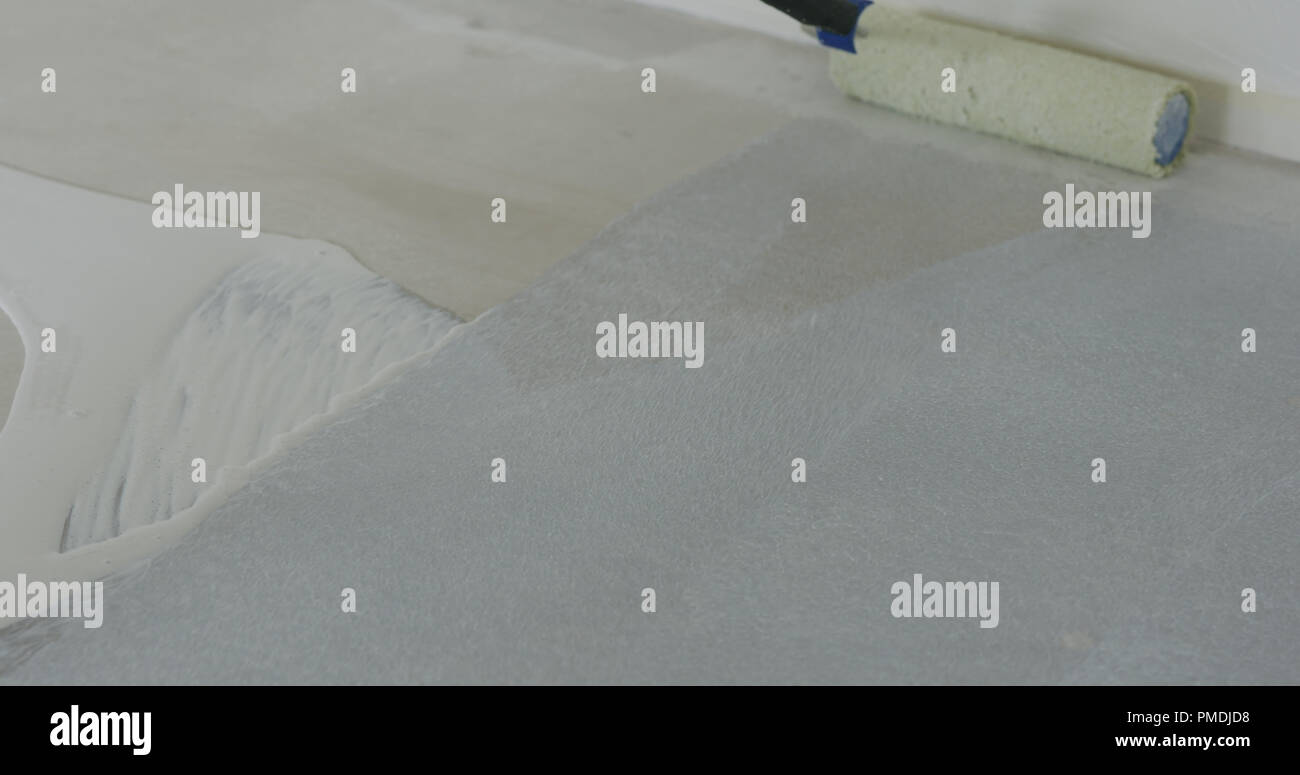 Applying liquid primer coating construction hi-res stock photography ...
