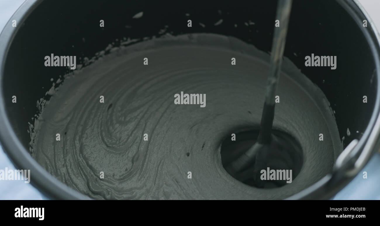 closeup mixing dark gray micro concrete plaster Stock Photo - Alamy