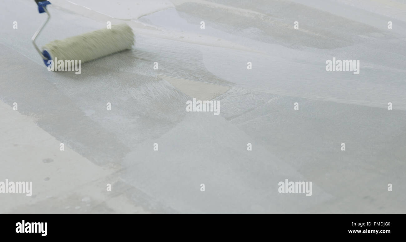 Applying liquid primer coating construction hi-res stock photography ...