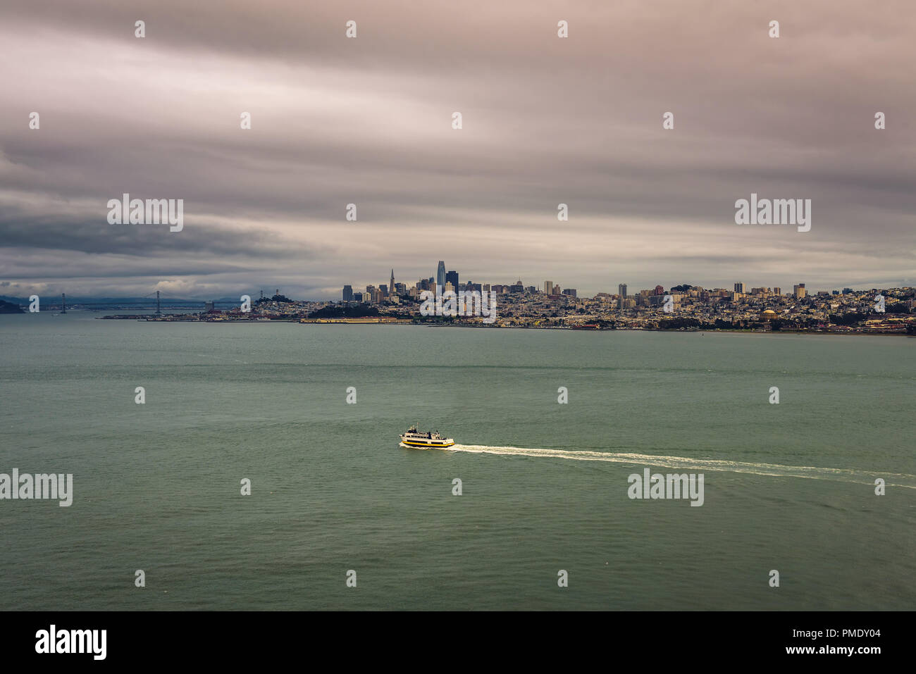 Ferry boat in the San Francisco Bay area with San Francisco skyline in ...