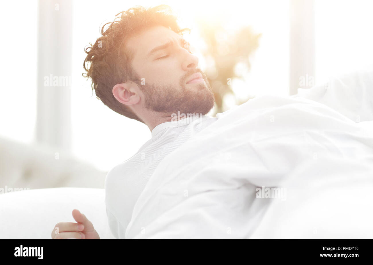 closeup.tired man sleeping on the bed Stock Photo - Alamy