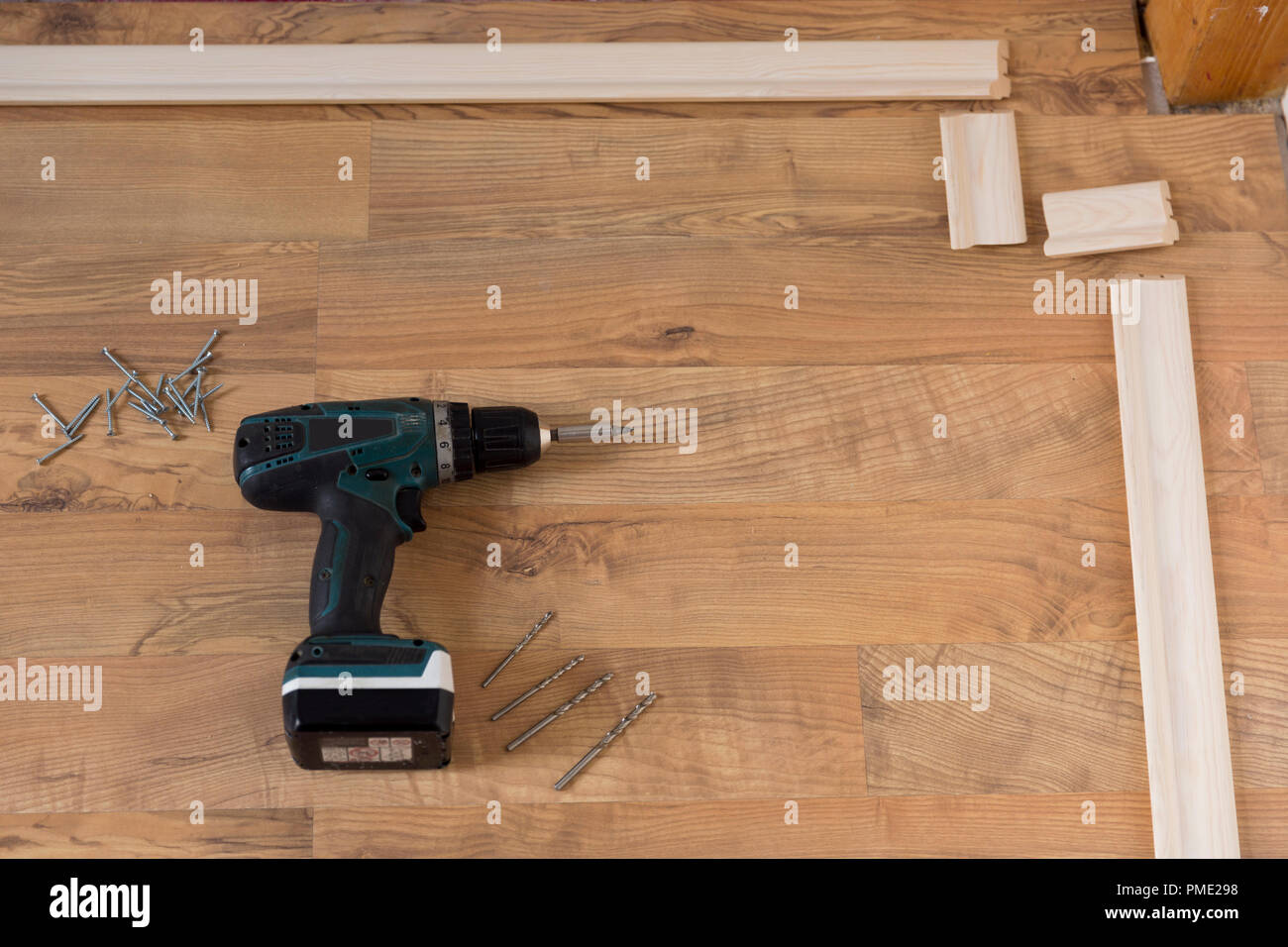 Home improvement. Installing floor moldings. Tools on floor Stock Photo ...