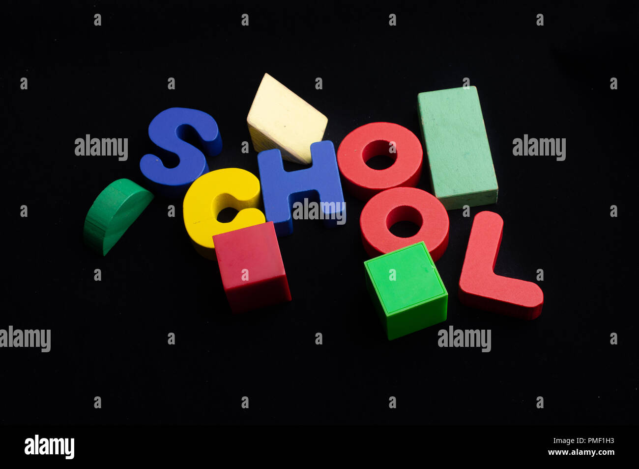 Education concept by School lettering with colorful wooden letters ...